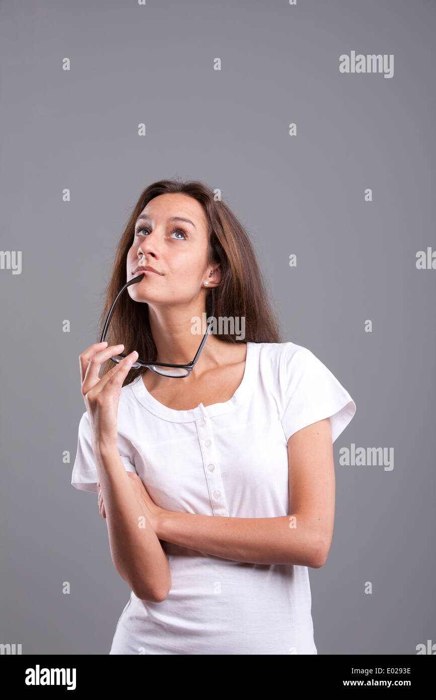 Pretty woman thinking or dreaming about infinite possibilities Stock ...