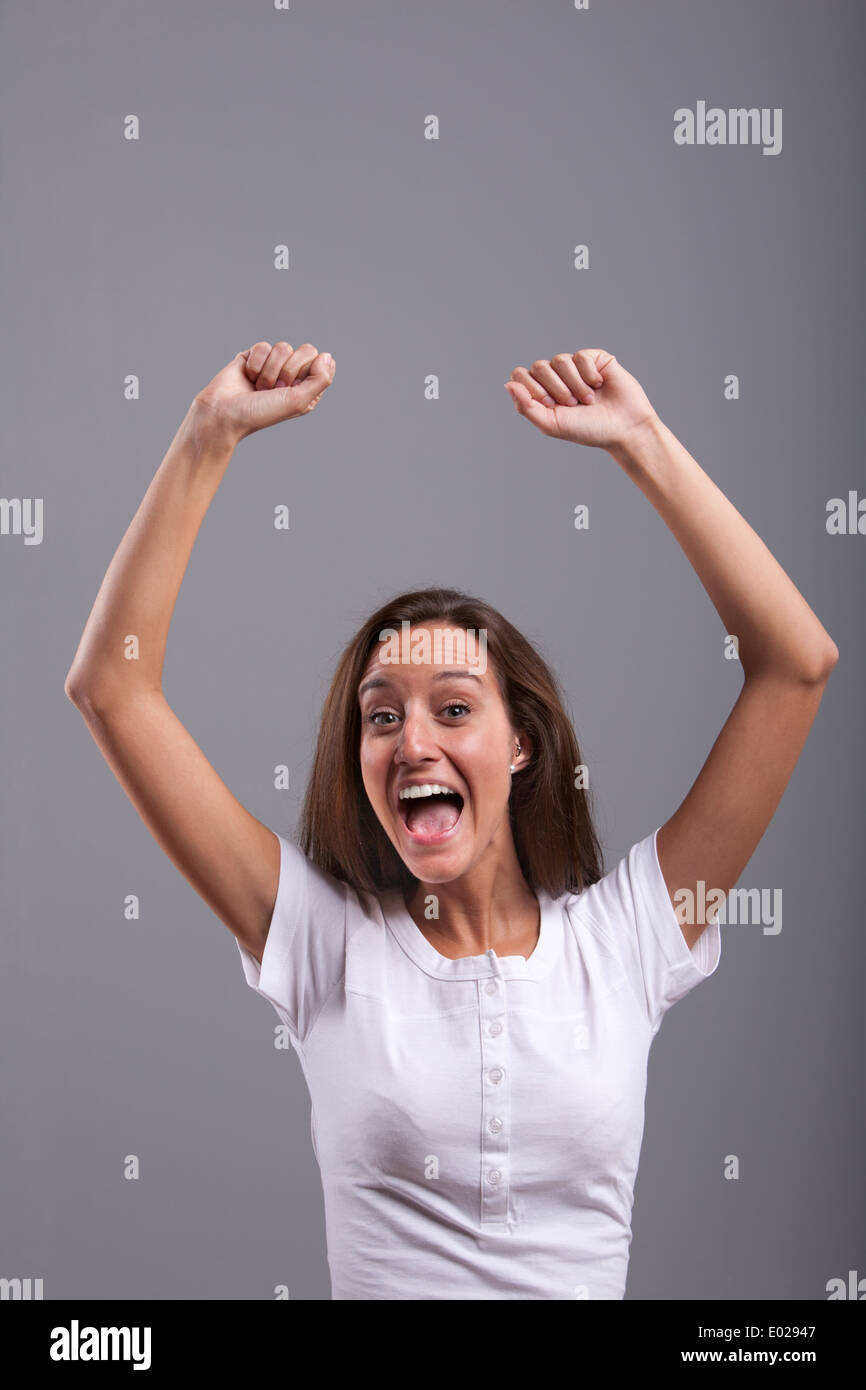 Joyful young woman raising her arms exulting Stock Photo - Alamy Joyful young woman raising her arms exulting Stock Photo - Alamy
