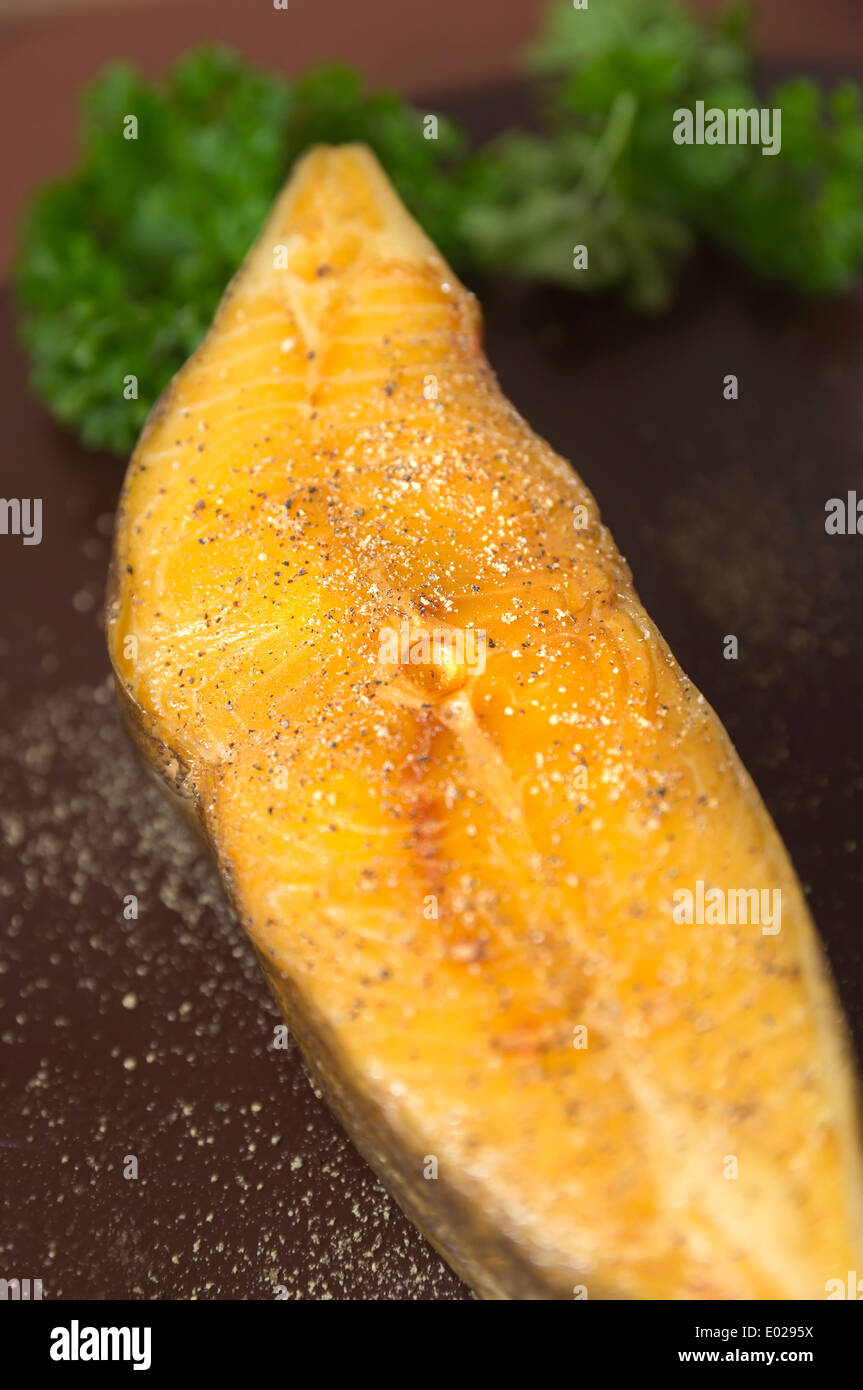 Smoked Halibut with black pepper and parsley Stock Photo - Alamy