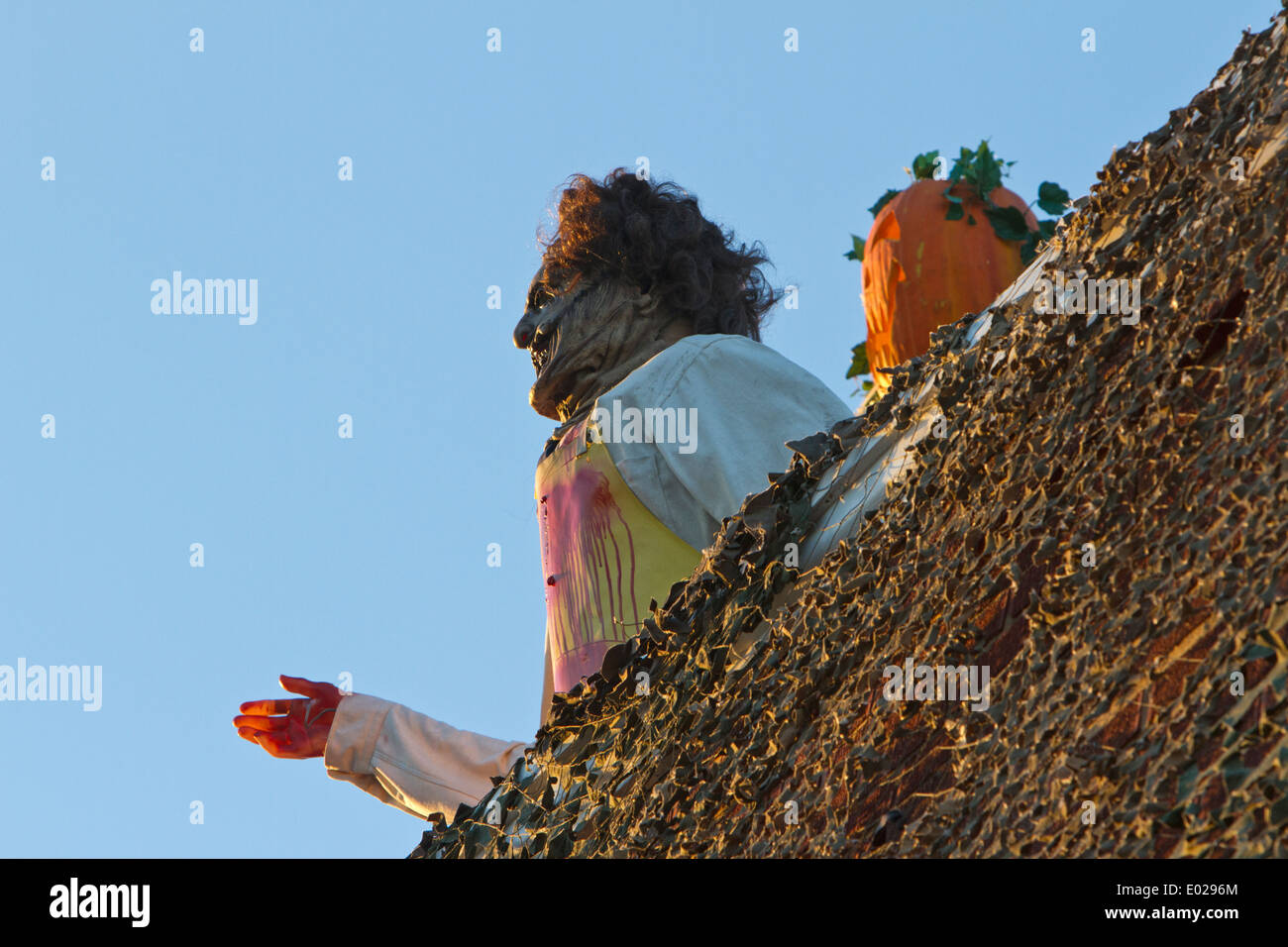 Zombie looking down from a rooftop Stock Photo - Alamy