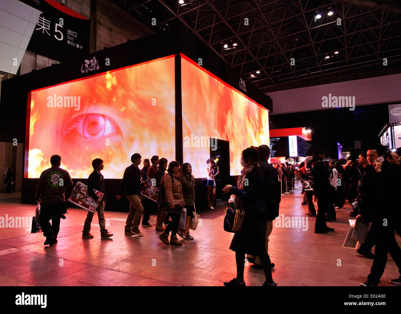 People passing a large display at Anime Fair AnimeJapan 2014. Tokyo ...