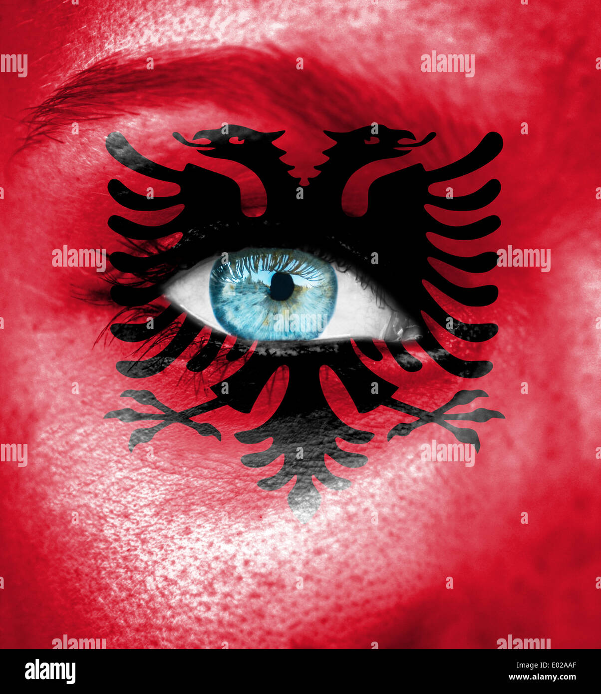 Woman face painted with flag of Albania Stock Photo - Alamy
