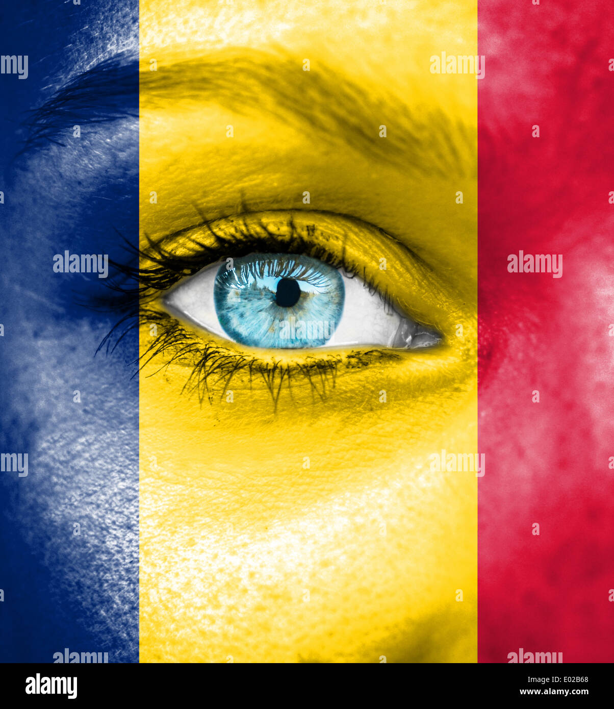 Woman face painted with flag of Chad Stock Photo - Alamy
