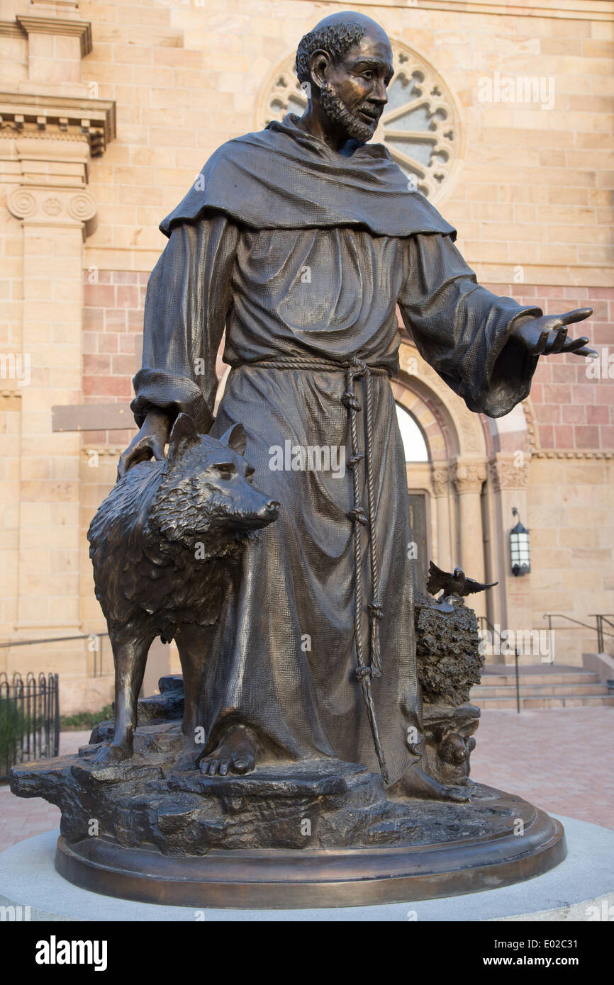Bronze statue of St Francis with a wolf in front of the Cathedral ...