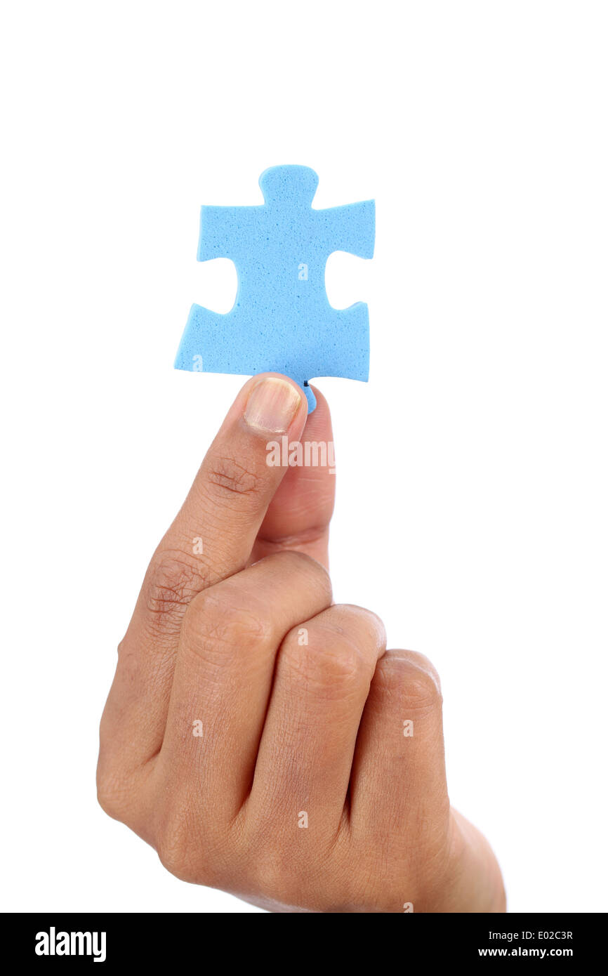 Hand with blue jigsaw puzzle isolated on white background Stock Photo ...