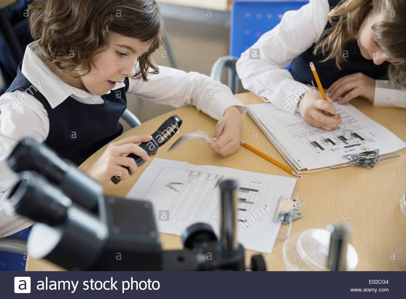 Two school girls in classroom hi-res stock photography and images - Alamy
