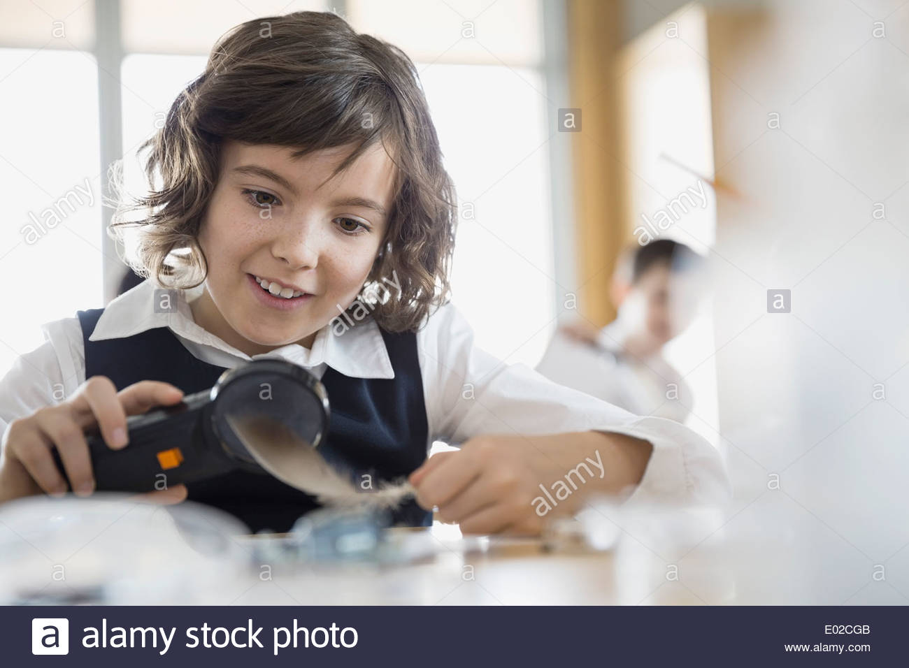 School girl conducting scientific experiment in classroom Stock Photo ...