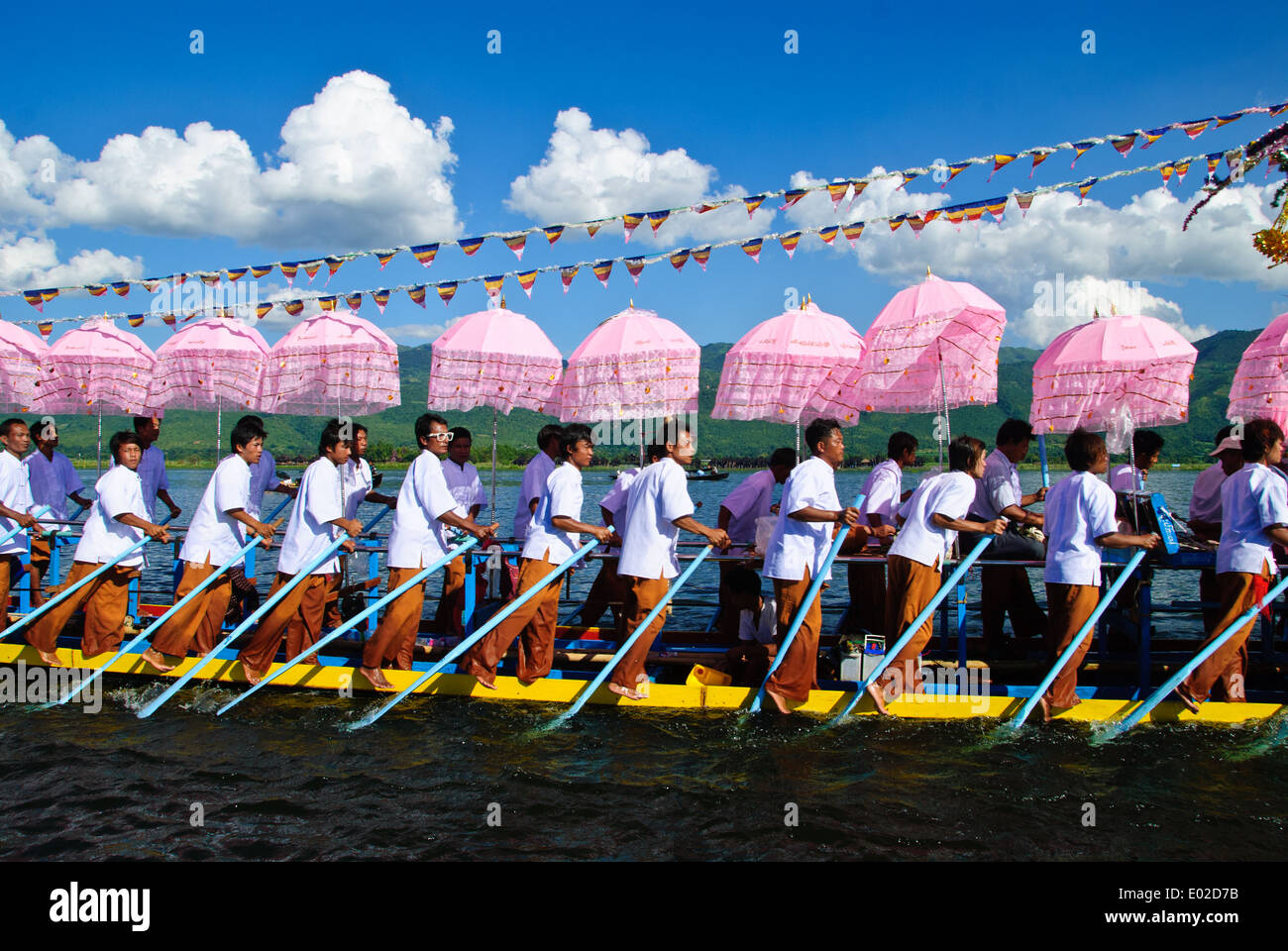 Leg-rowers moving forwards pulling the royal barge across Inle Lake ...