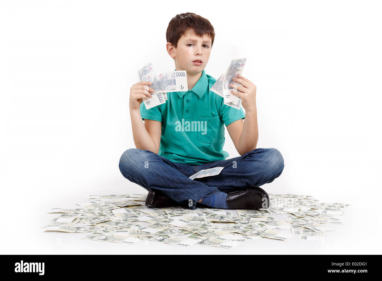 boy sitting on money, money concept, how to be successful, isolated on ...