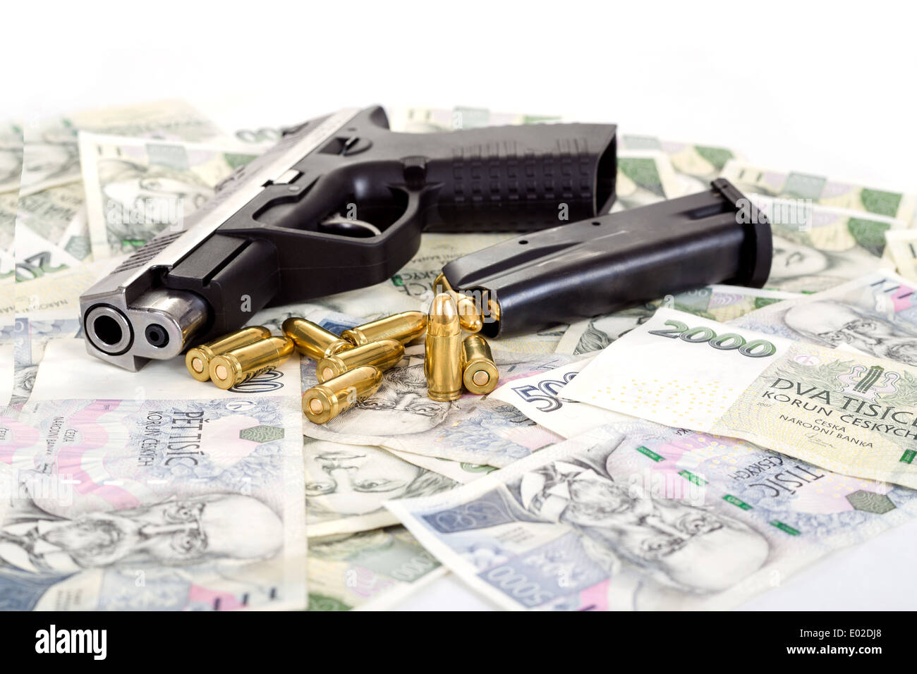 detail of gun with bullet on czech banknotes background Stock Photo - Alamy