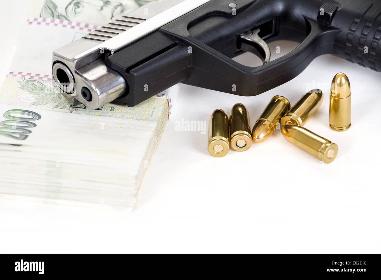 gun with bullet and czech banknotes isolated on white background Stock ...