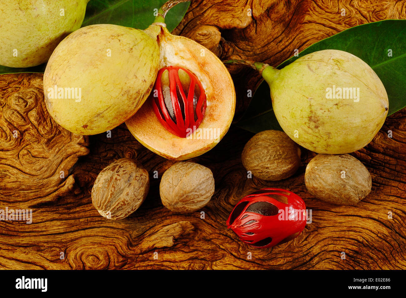 nutmeg fruits on wooden background Stock Photo - Alamy
