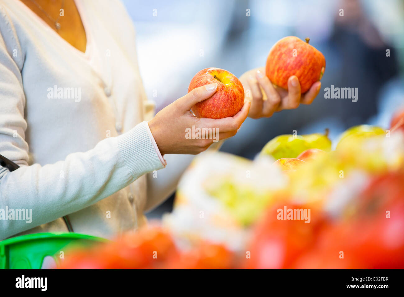 Female close-up hand apple orange grape Stock Photo - Alamy