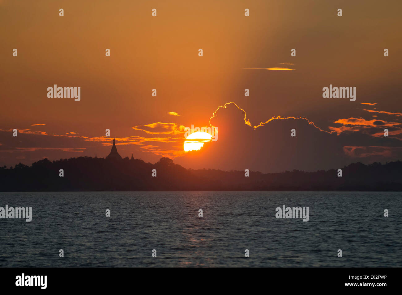 Pagoda, sunset behind clouds, Kaladan River, Sittwe District, Rakhine ...