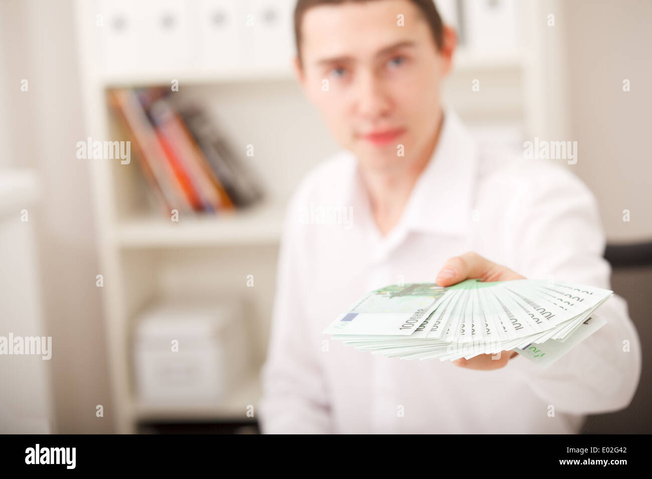 man holding euro money Stock Photo - Alamy