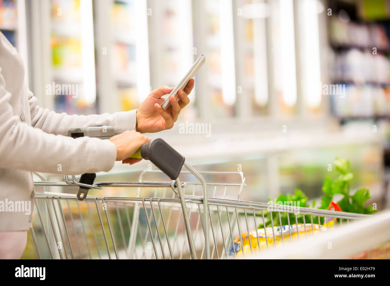 Female store cell phone close-up Stock Photo - Alamy