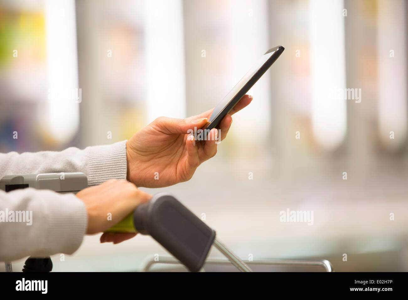 Female store cell phone close-up Stock Photo - Alamy