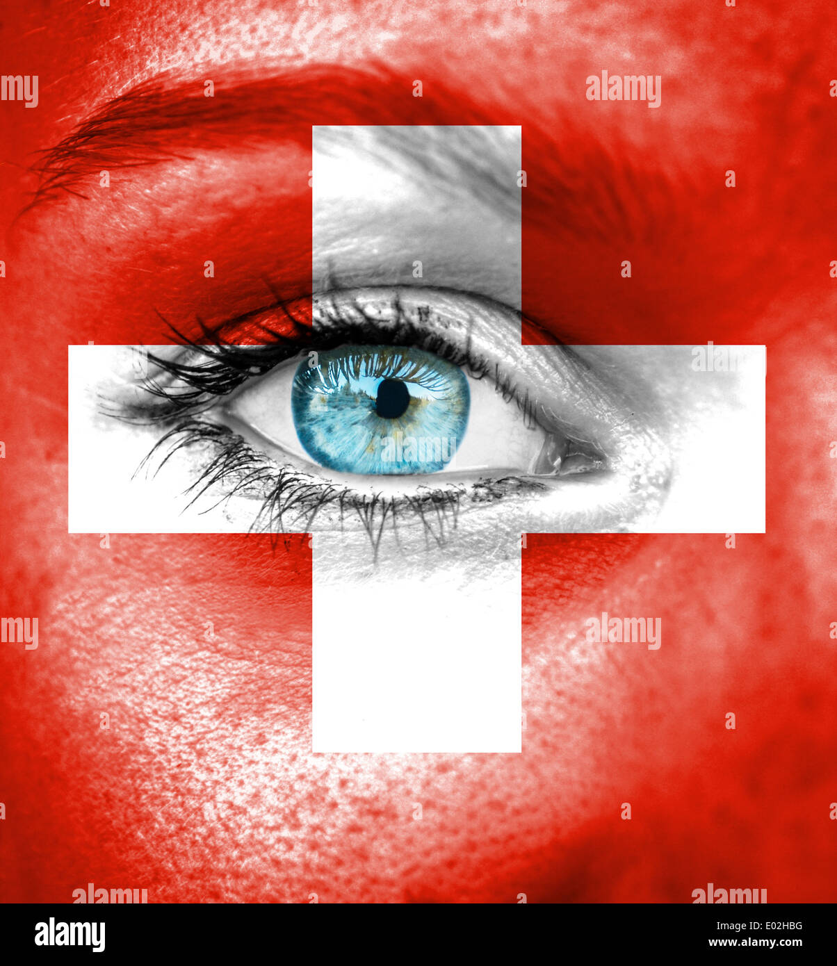 Woman face painted with flag of Swiss Stock Photo - Alamy
