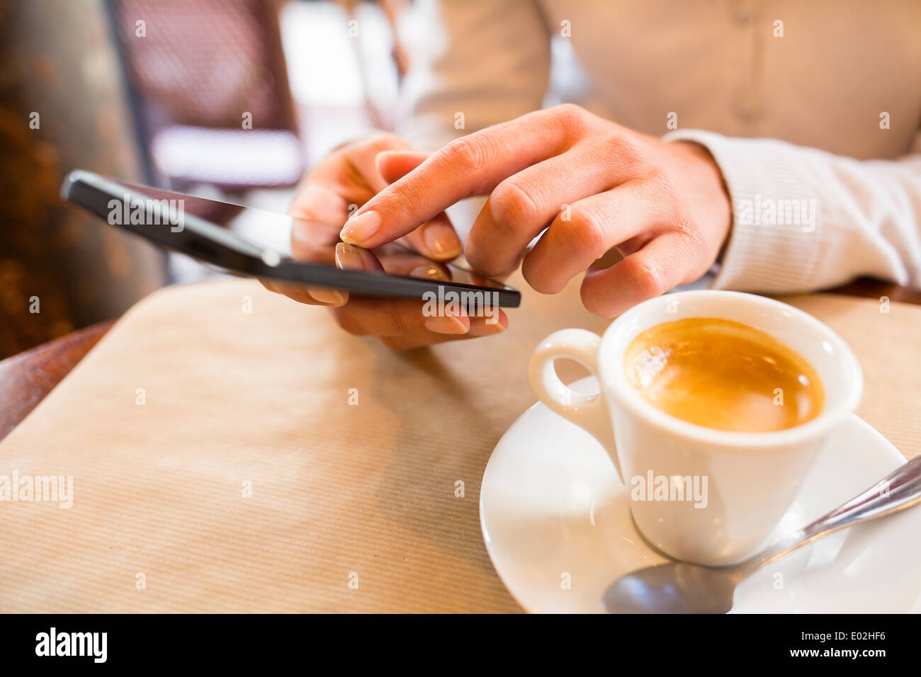 Female smart phone coffee bar sms mail Stock Photo - Alamy