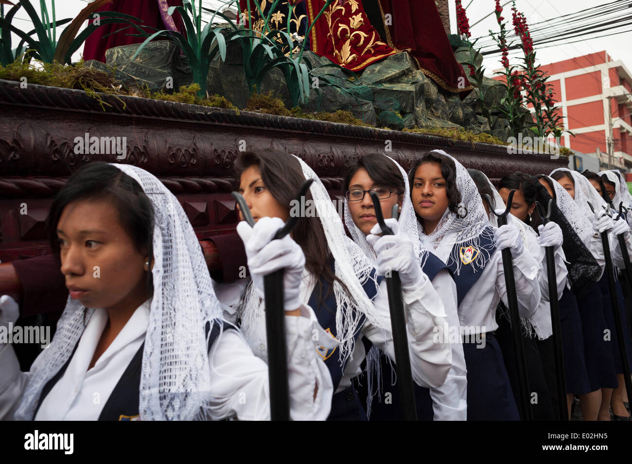 Guatemala City, Guatemala. 15th Mar, 2013. Young women carry a float ...