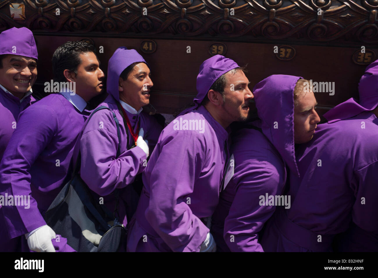 Antigua, Guatemala. 17th Mar, 2013. Cucuruchos carry a heavy religious ...
