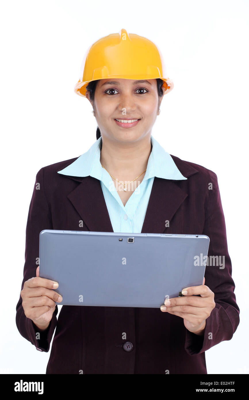 Young Indian female engineer with tablet against white background Stock ...