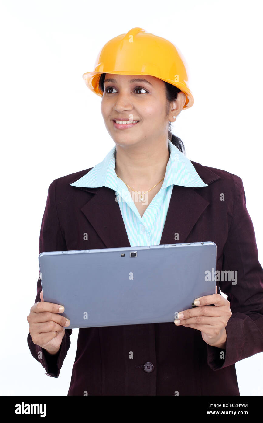 Young Indian female engineer with tablet against white background Stock ...