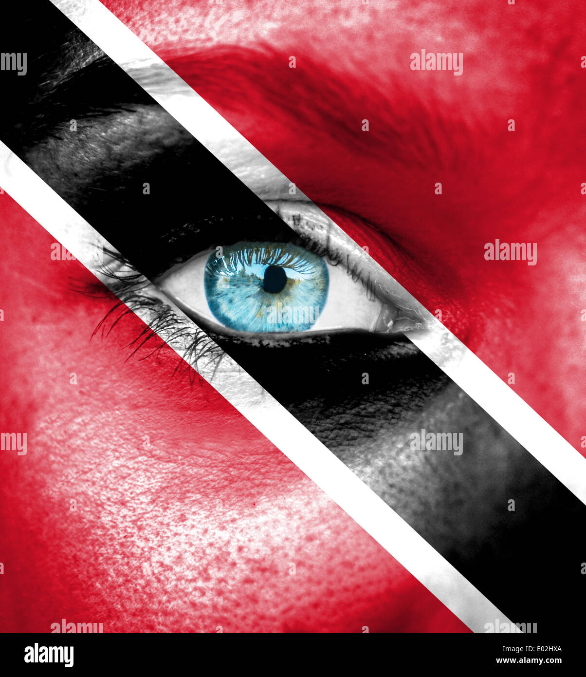 Woman face painted with flag of Trinidad and Tobago Stock Photo - Alamy