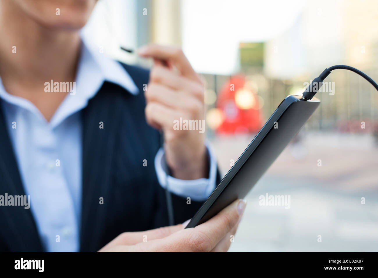 Female Mobile phone hand outdoor Building Stock Photo - Alamy