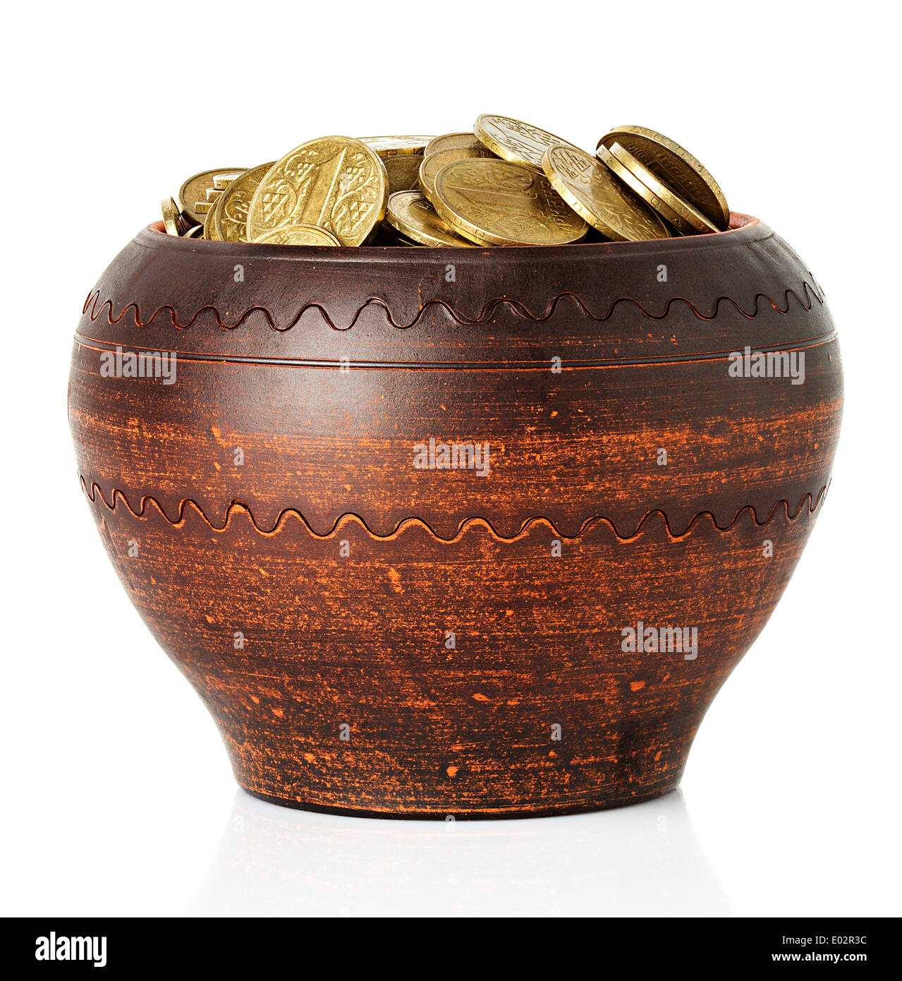 ceramic pot full of coins close-up isolated on white background Stock ...