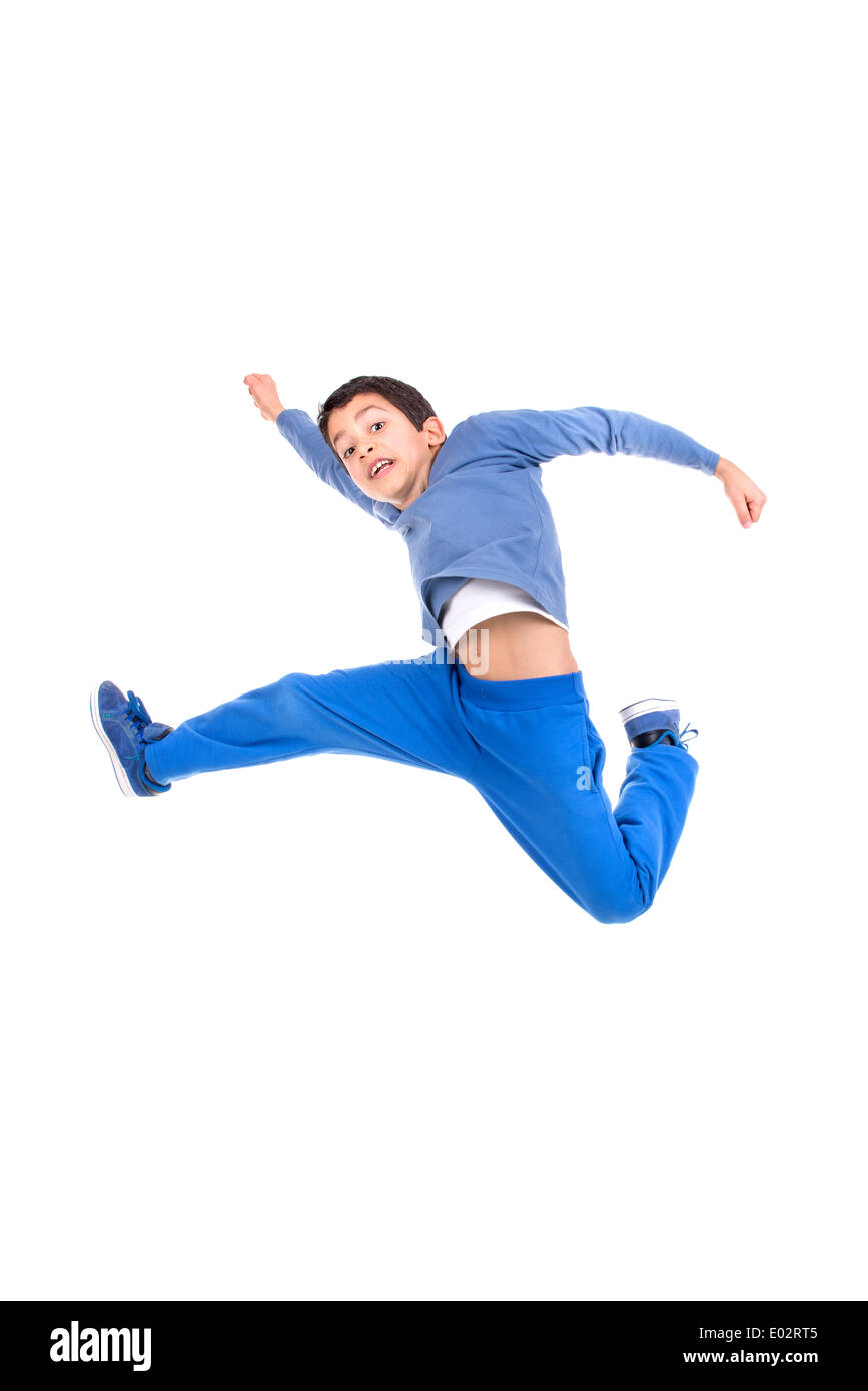 Young boy jumping isolated in white Stock Photo - Alamy