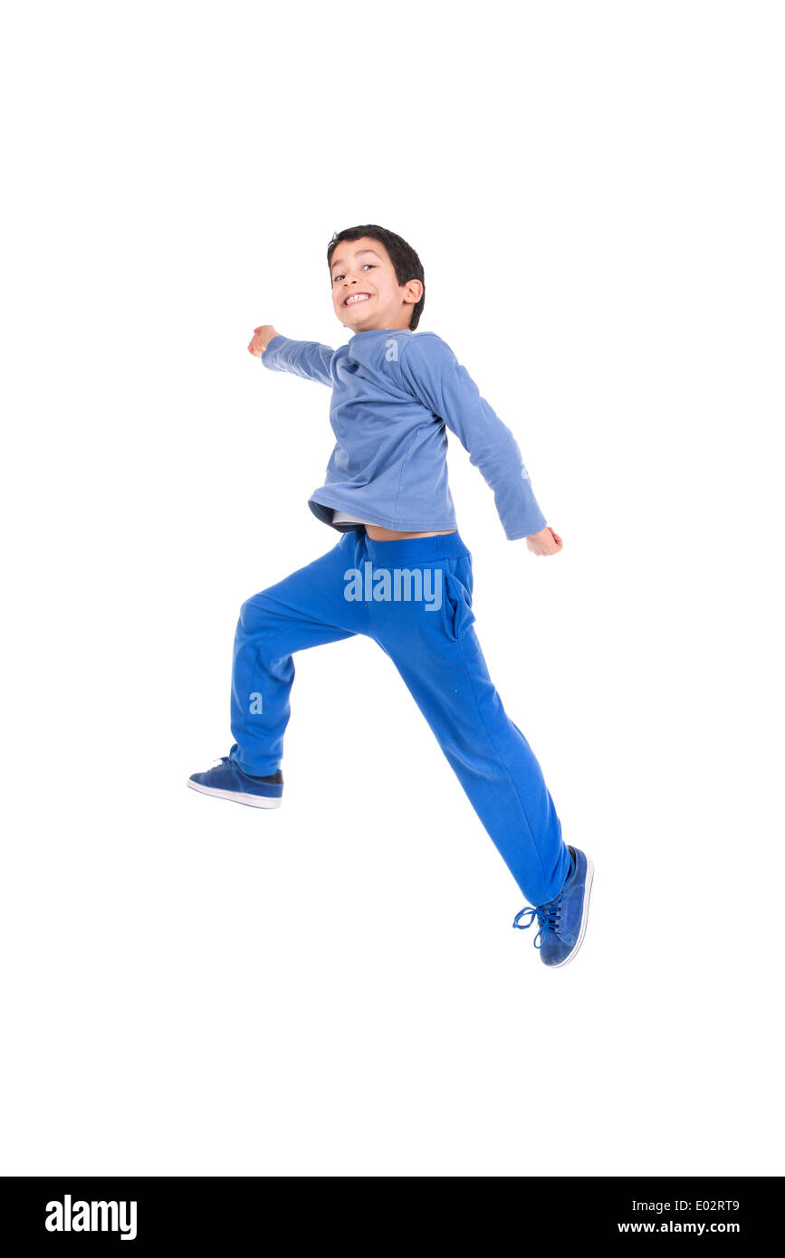Young boy jumping isolated in white Stock Photo - Alamy