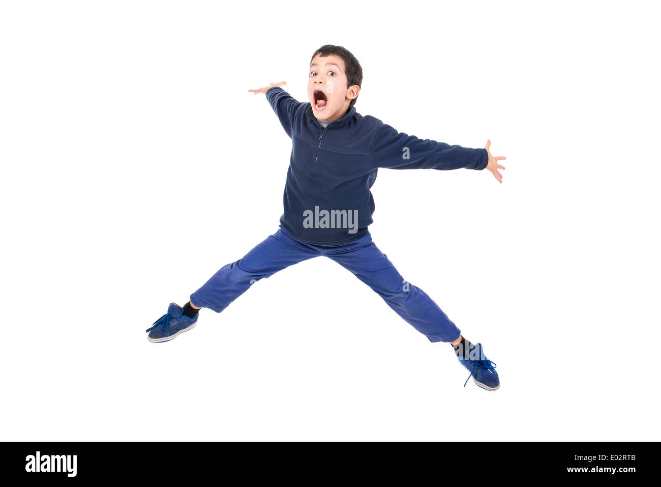 Young boy jumping isolated in white Stock Photo - Alamy