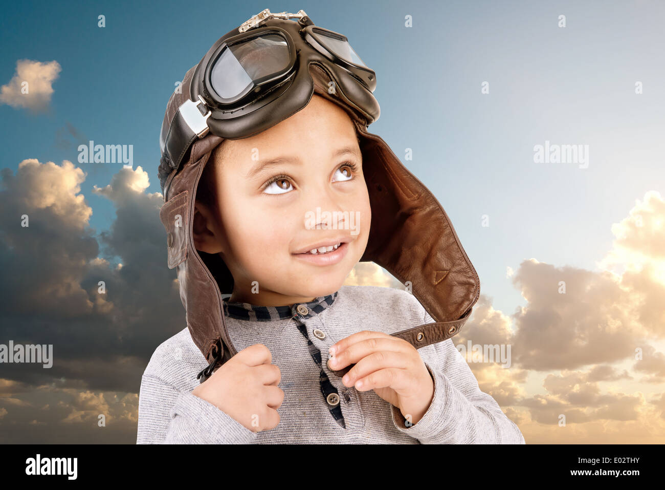 Young boy with pilot helmet isolated against the sky Stock Photo - Alamy