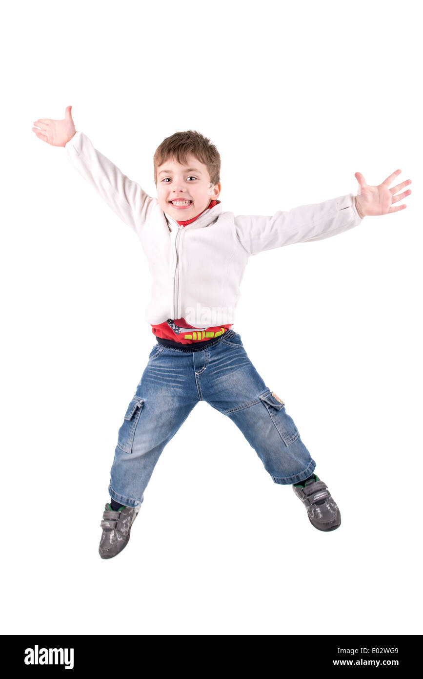 Young boy jumping isolated in white Stock Photo - Alamy