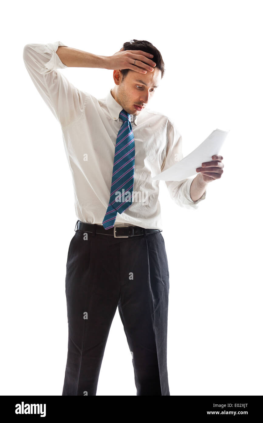 Shocked businessman looking at some documents Stock Photo - Alamy
