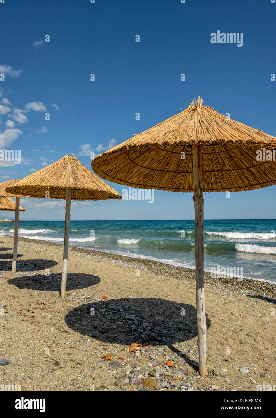 Resort beach with straw parasol Stock Photo - Alamy