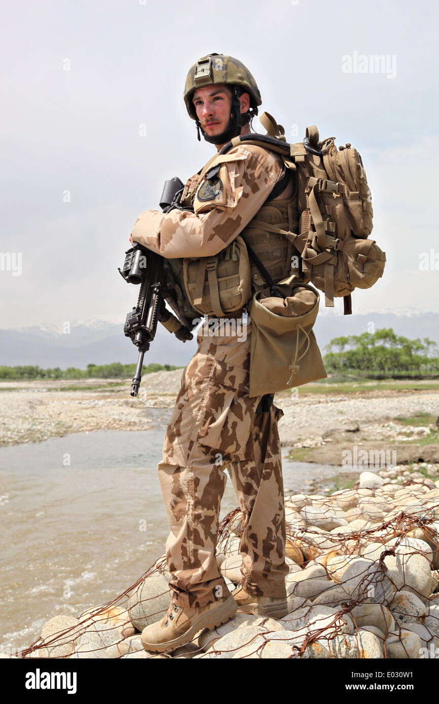 A Czech Republic soldier provides security during a counterinsurgency ...