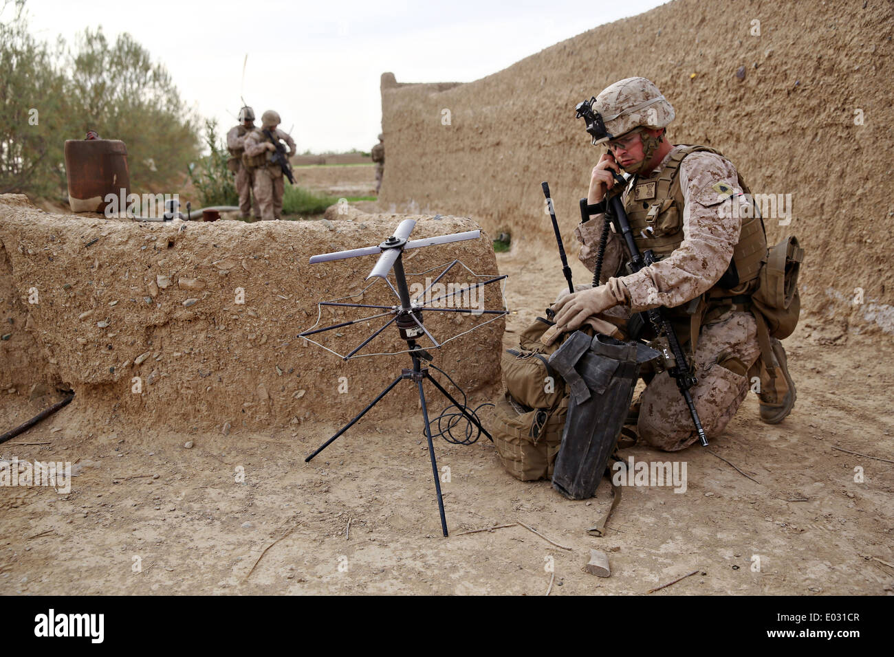 US Marine Sergeant Steven Olson speaks by satellite telephone during a ...