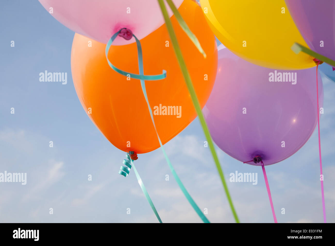 A group of coloured balloons floating in the air Stock Photo - Alamy