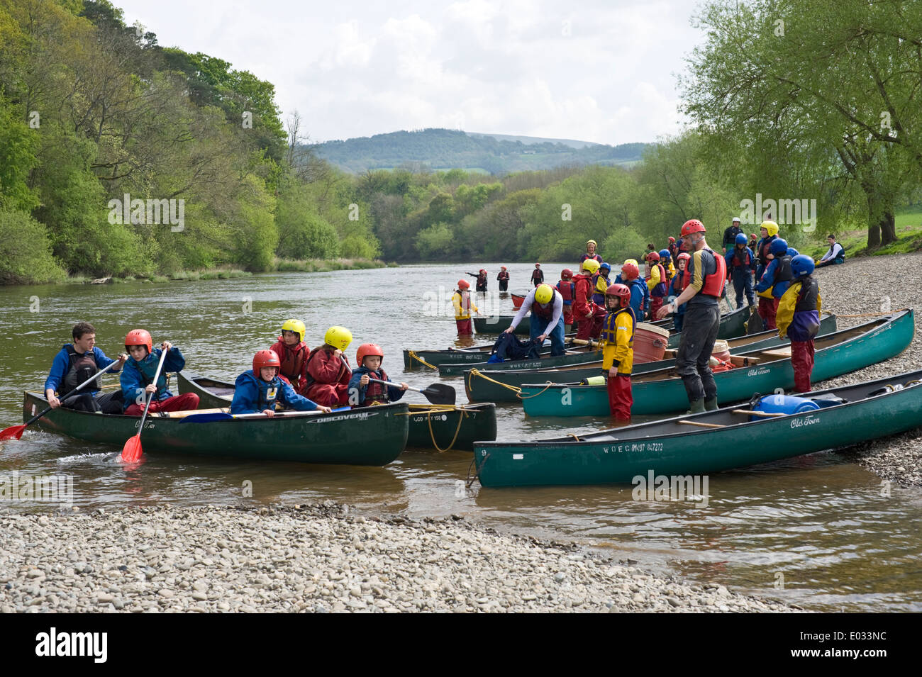 Groups of school children on outward bound canoeing expedition on the ...