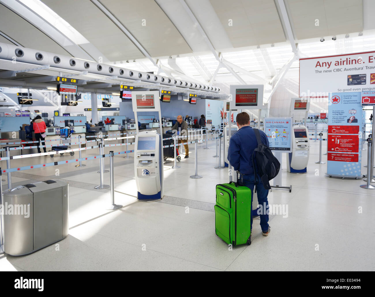 Person at self check in machine at Toronto Pearson International ...