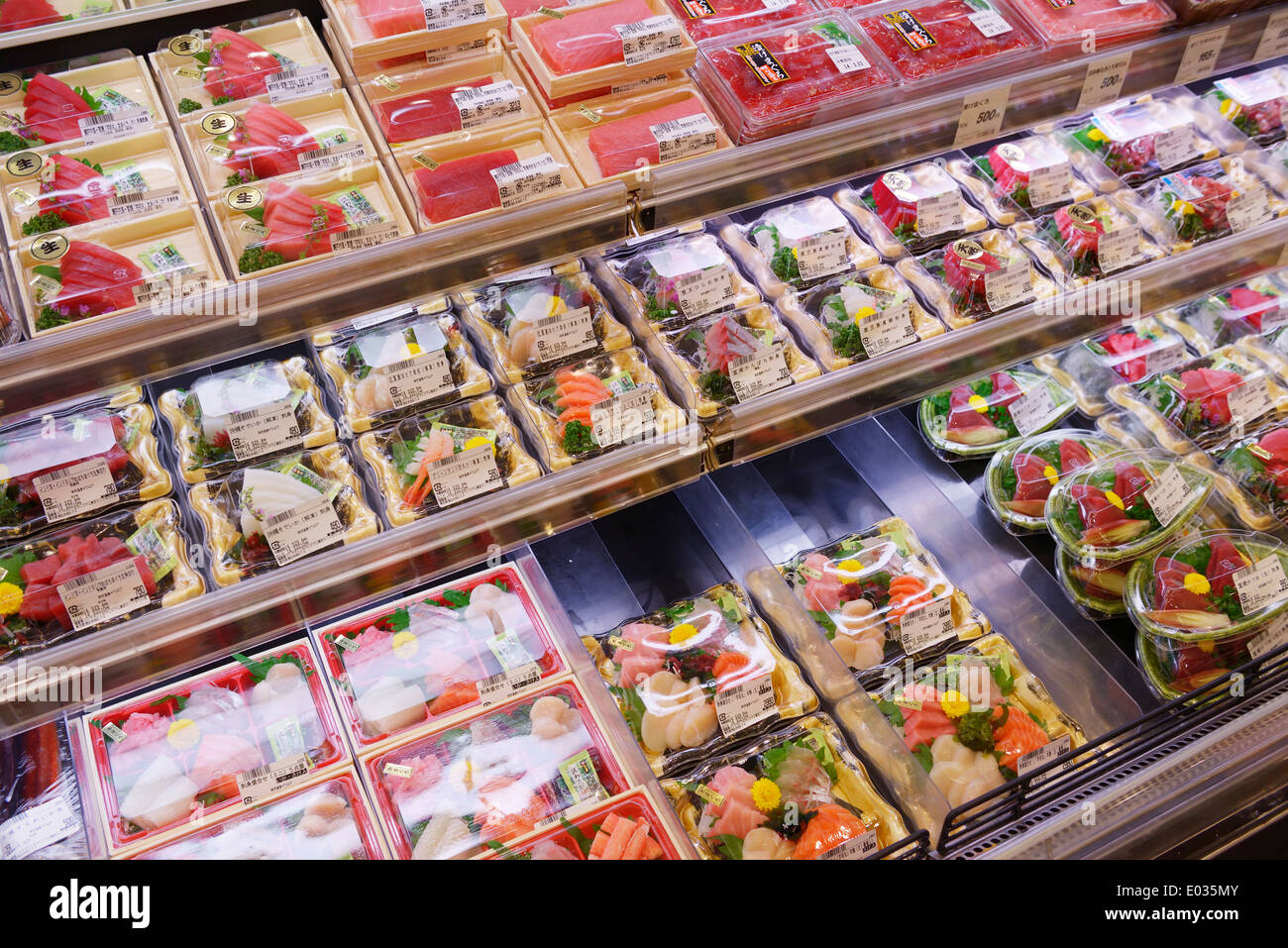 Packaged sashimi seafood on display in a Japanese supermarket. Tokyo ...