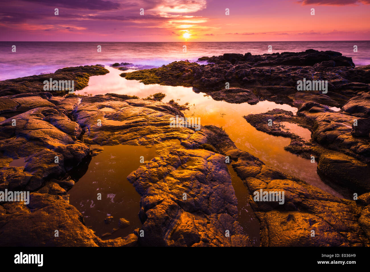 Tidepool reflection of sunset and clouds hi-res stock photography and ...