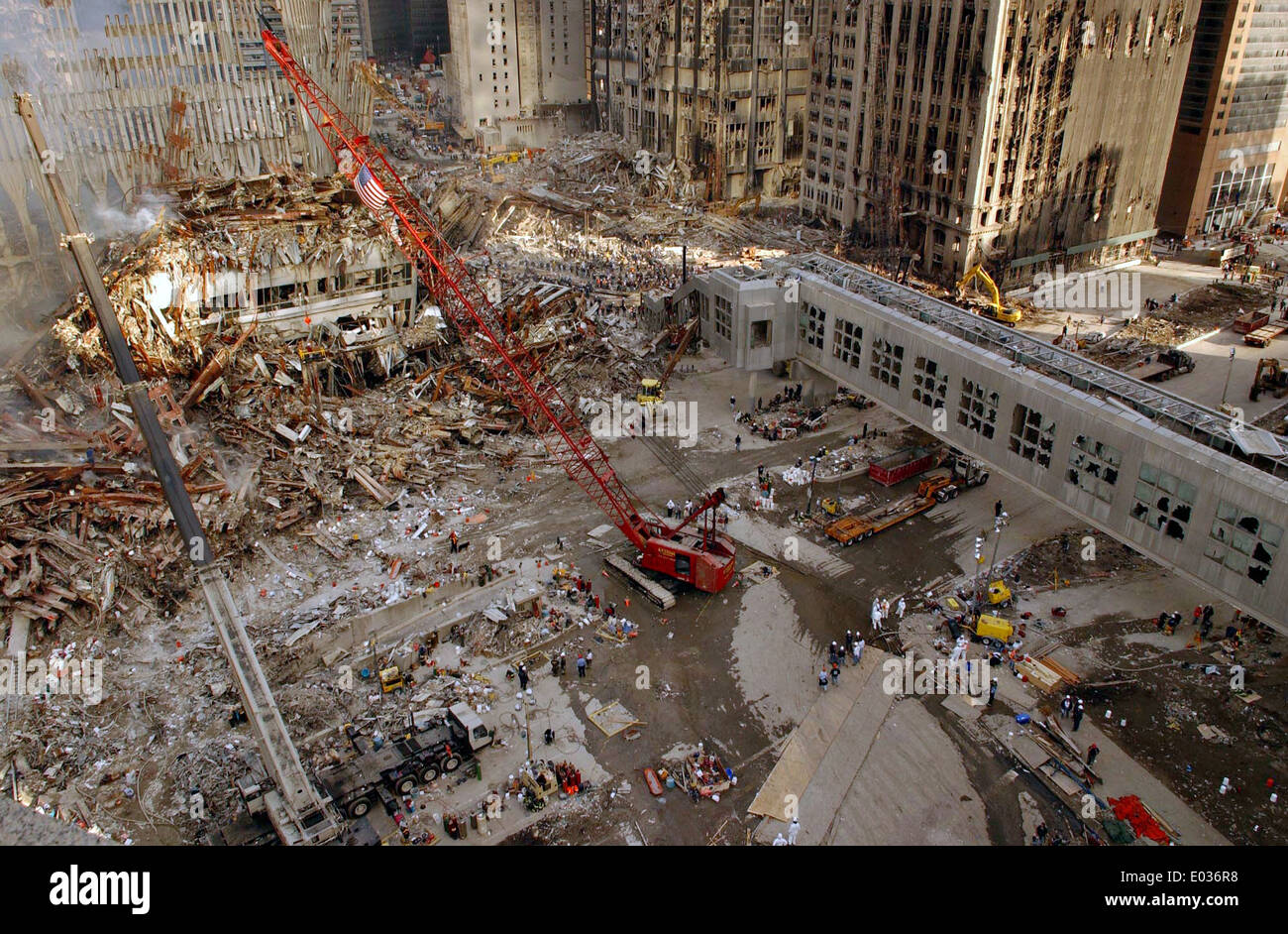 Emergency crews begin the process of removing rubble from the wreckage ...