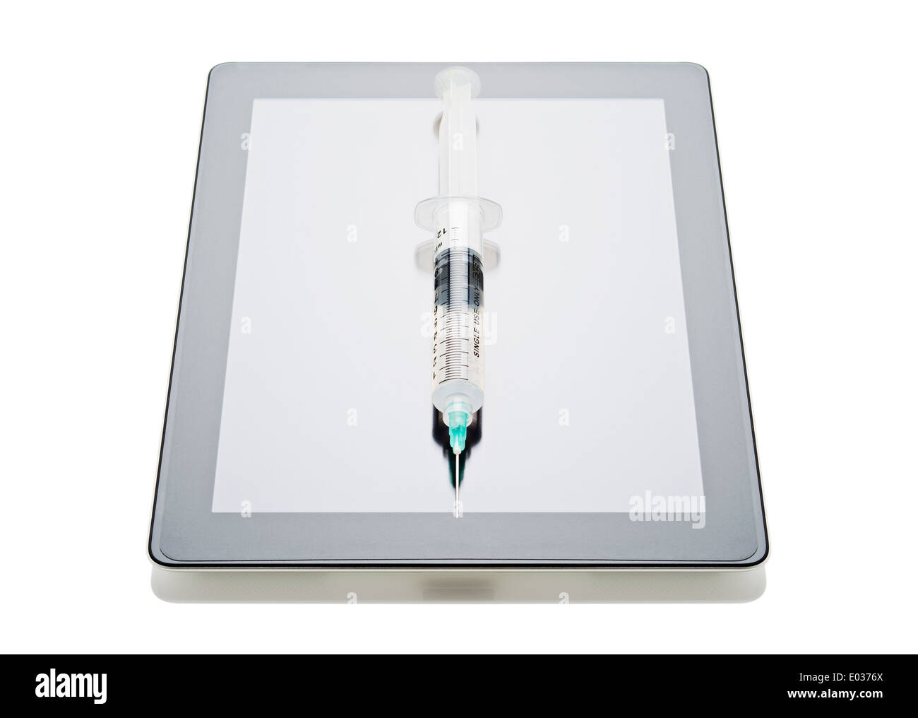 Digital tablet and syringe Stock Photo - Alamy