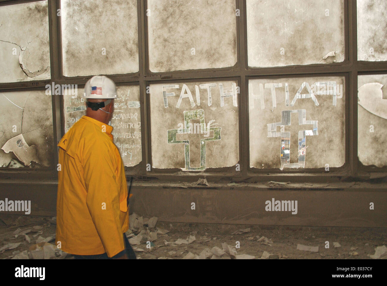 An Urban Search and Rescue worker views religious messages on the ...
