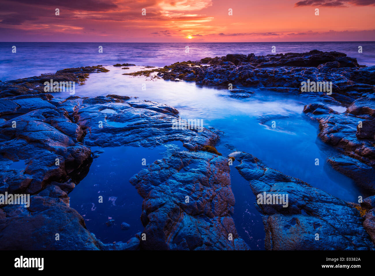 Tidepool reflection of sunset and clouds hi-res stock photography and ...