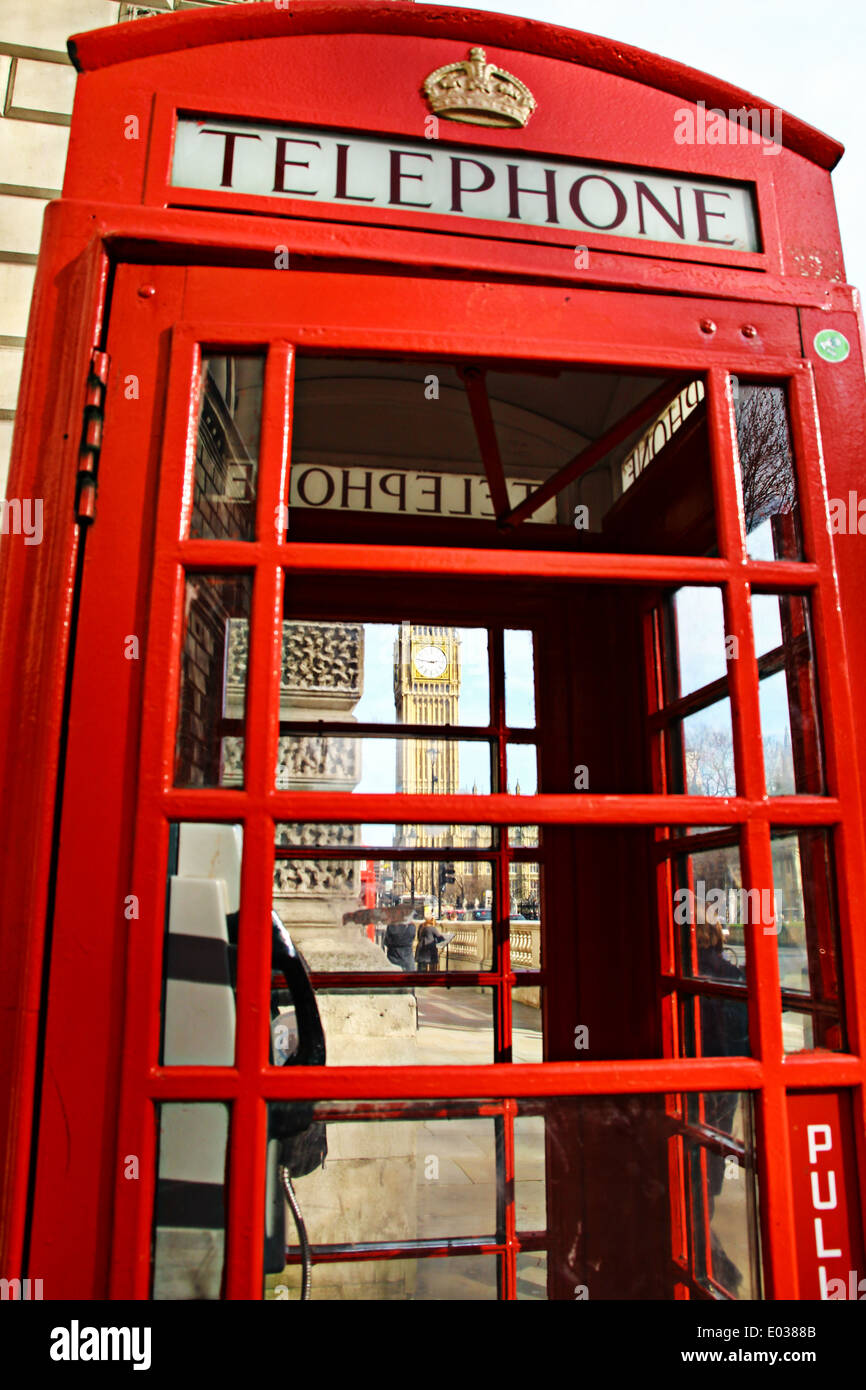 The classic red telephone booth with the Big Ben behind Stock Photo - Alamy
