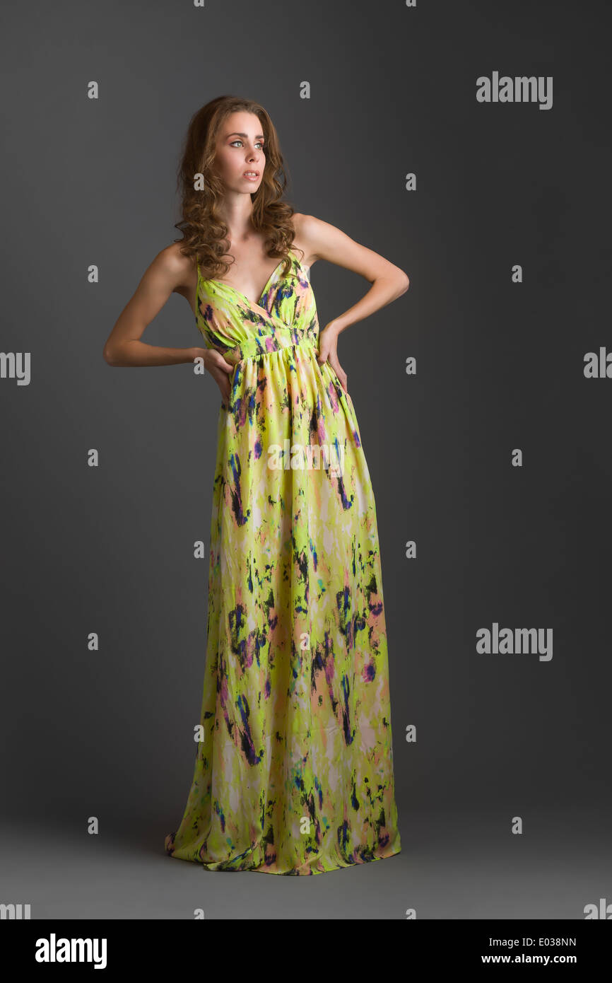 Young woman wearing yellow dress hi-res stock photography and images ...